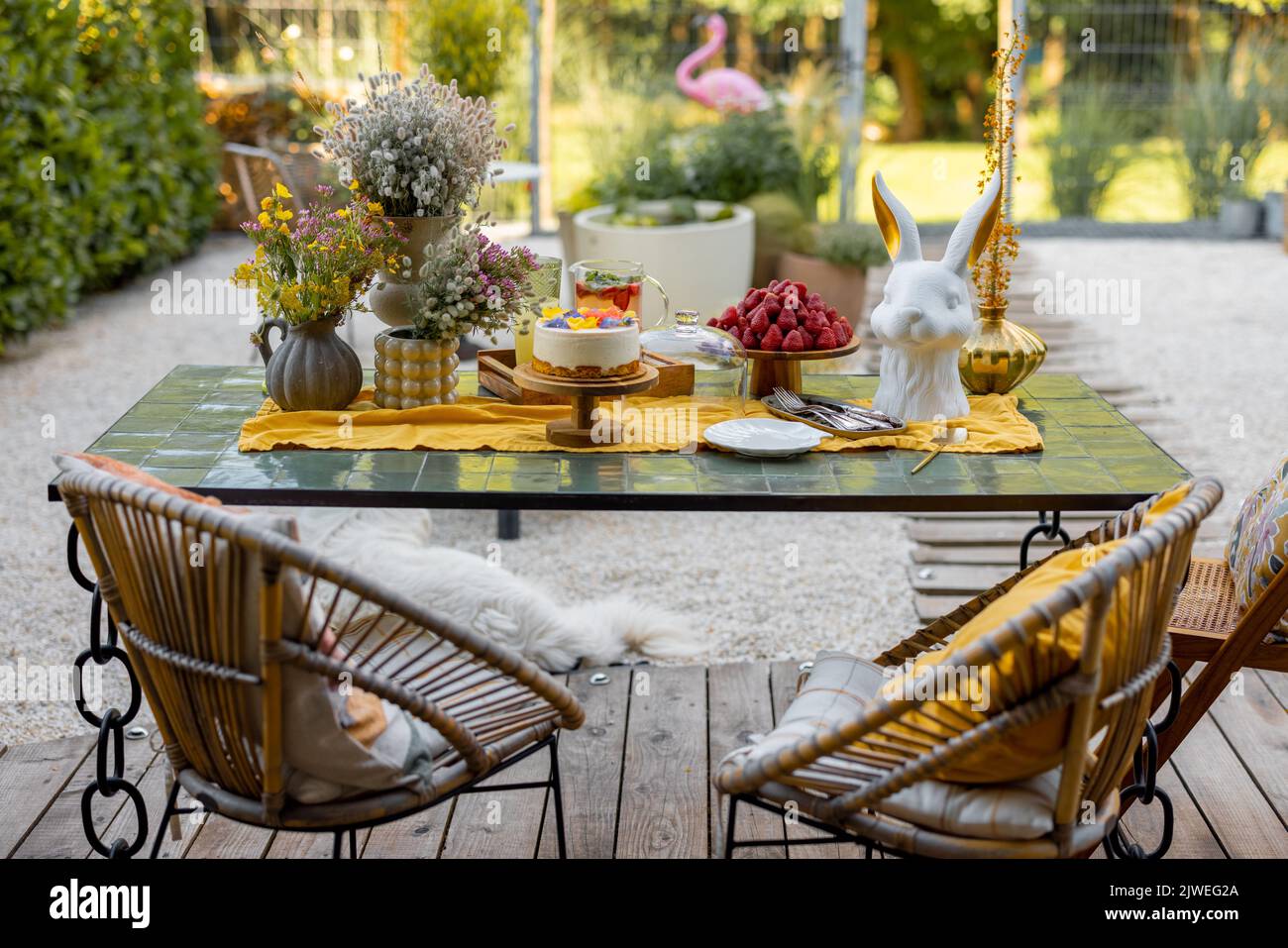 Cozy dining place on wooden terrace at backyard Stock Photo - Alamy