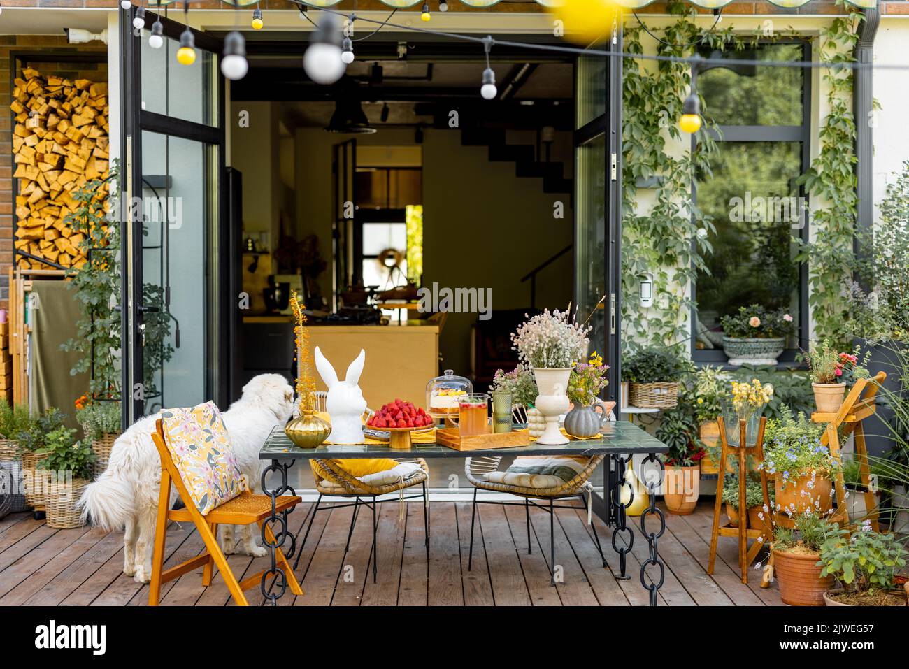 Cozy dining place on wooden terrace at backyard Stock Photo - Alamy