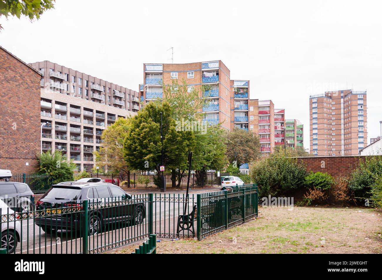 A several high-rise council estate tower blocks stand over streets of ...