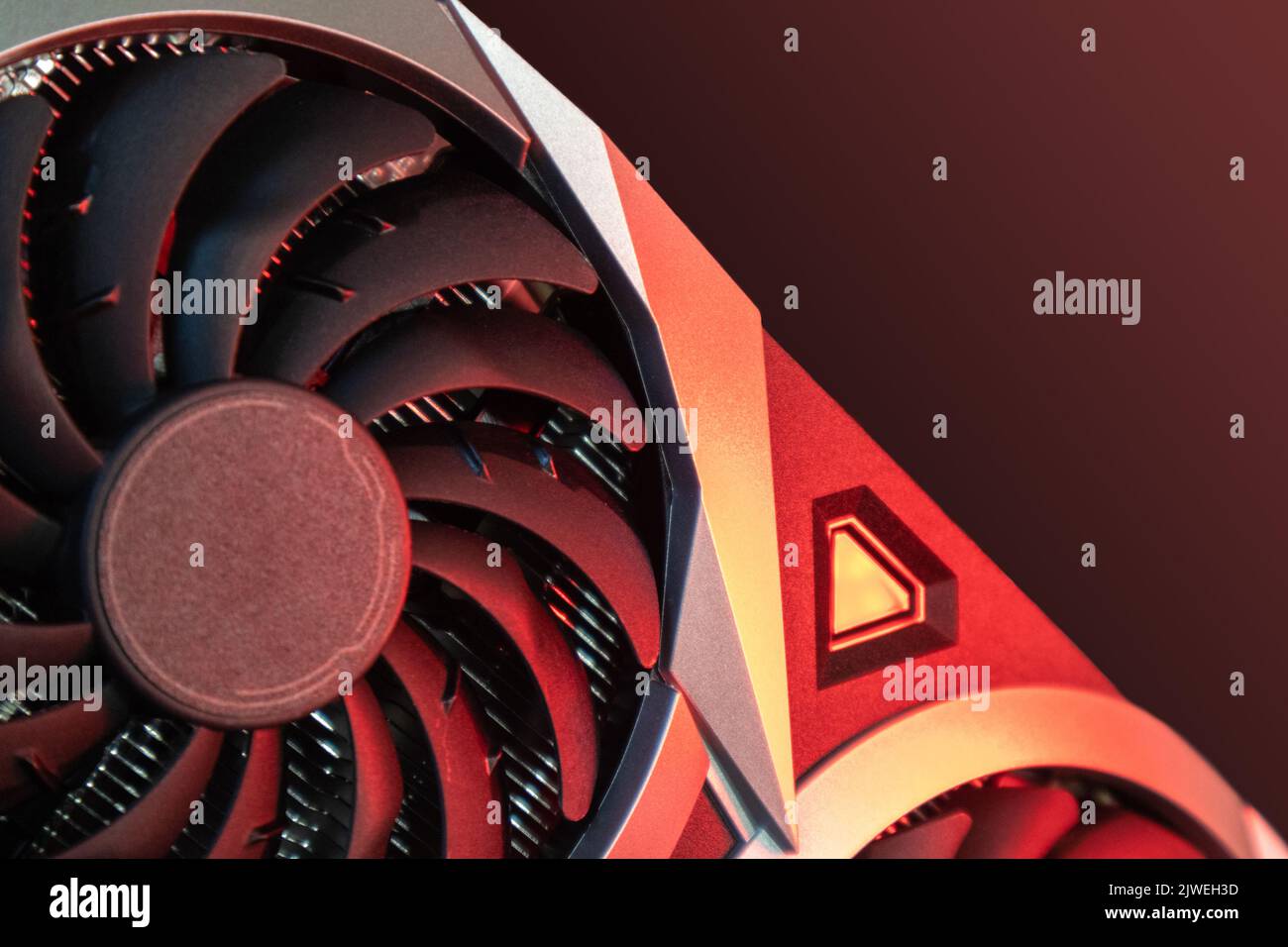 Cooler fan on Gpu graphics video card, close-up in red light, PC ...
