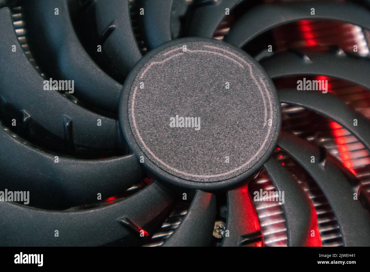 Cooler blades on Gpu graphics video card, close-up with red light and ...
