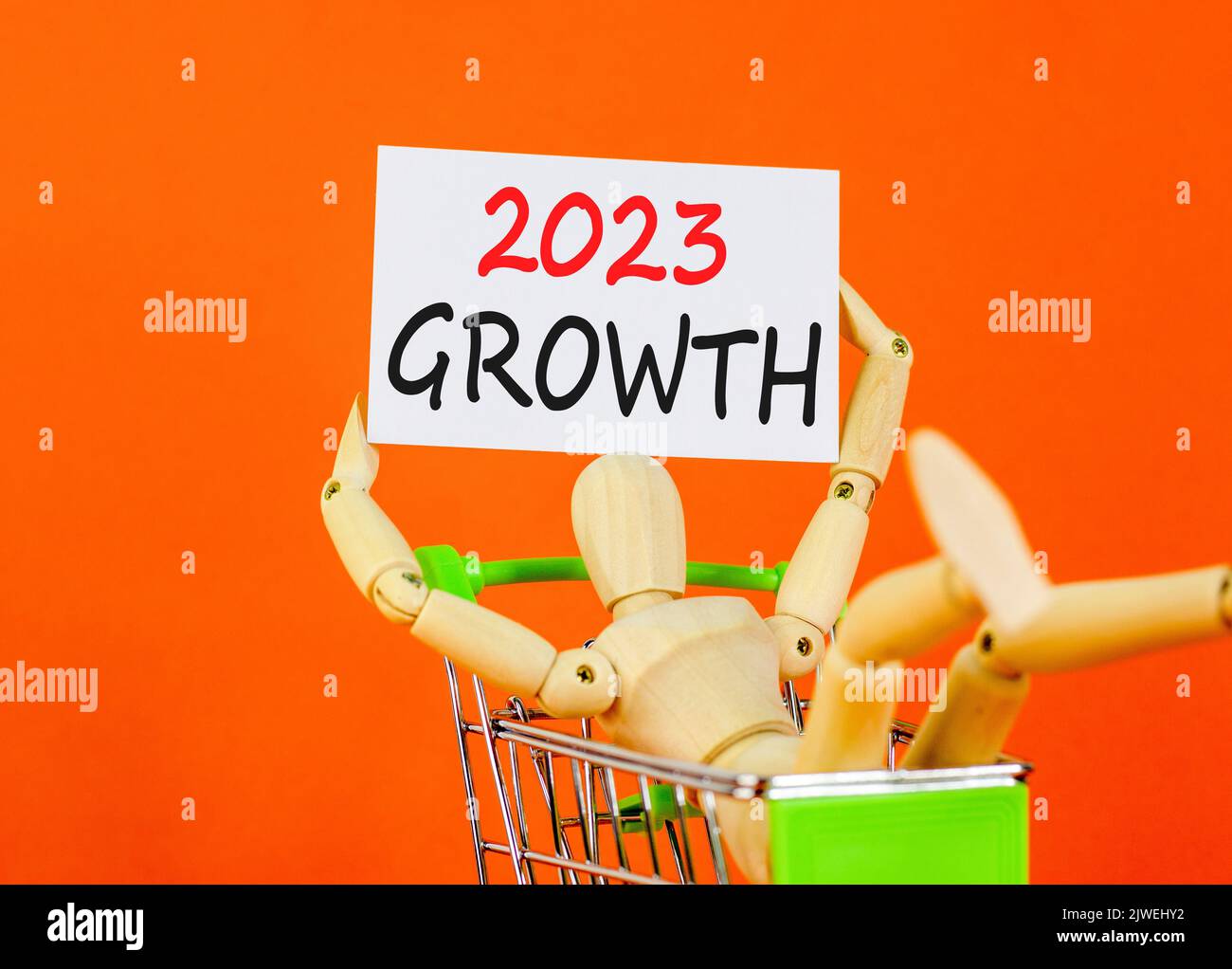 2023 Growth symbol. White paper with words 2023 Growth, human model in ...