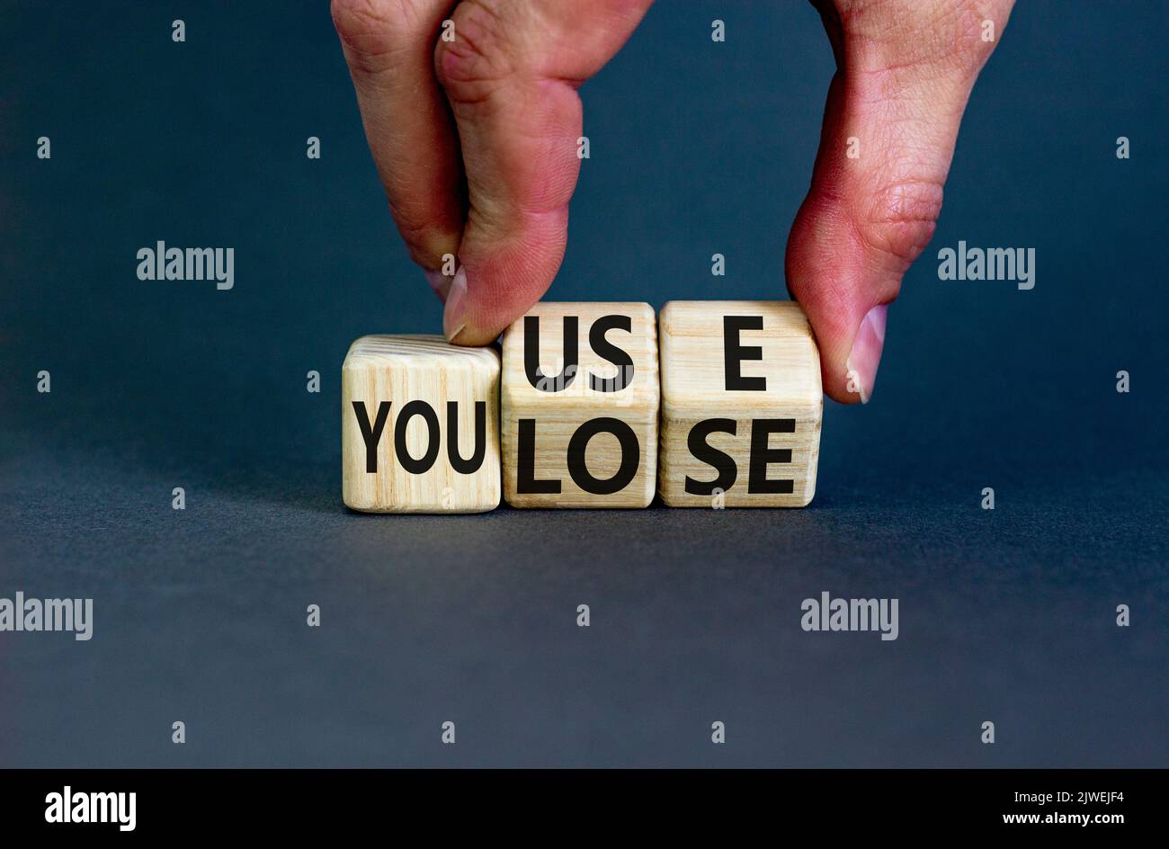You use or lose it symbol. Concept words You use and You lose on wooden ...