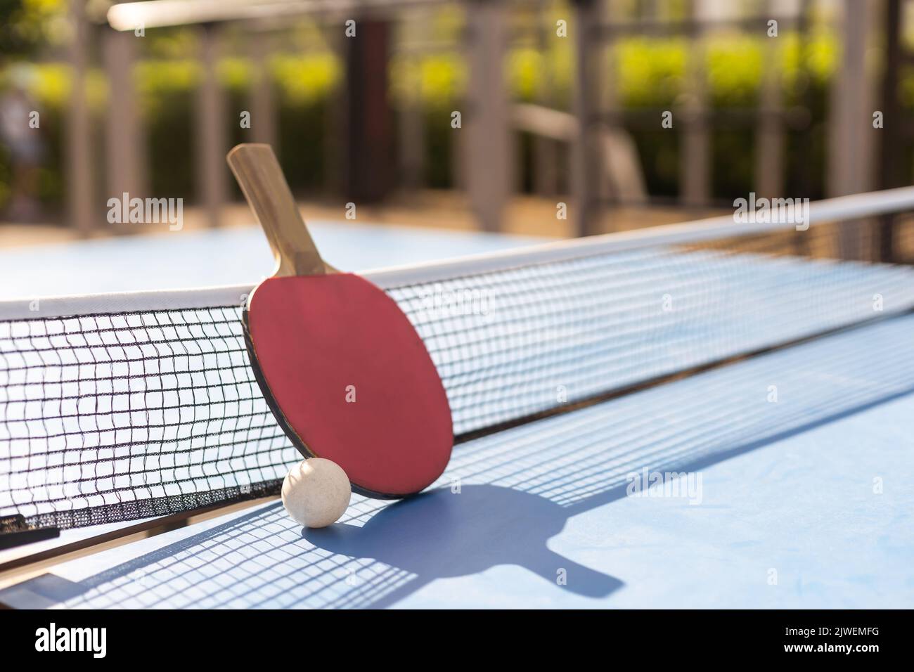 Ping pong table, rackets and balls Stock Photo - Alamy