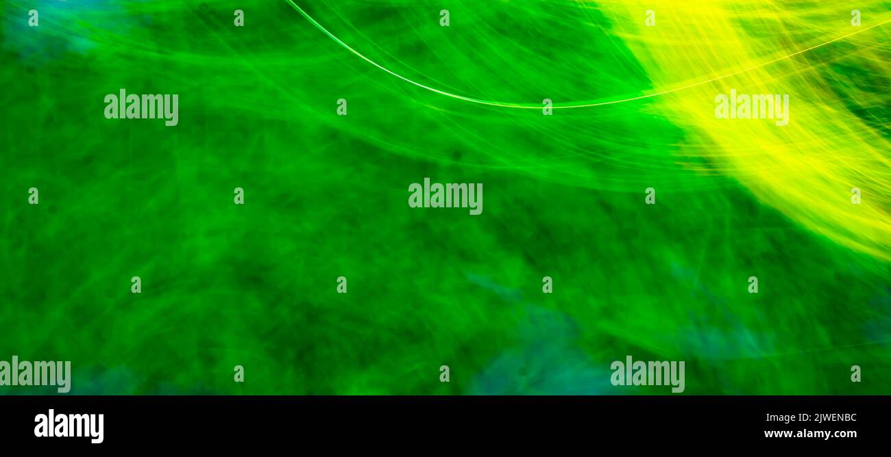 Abstract, bright green acidic background with a yellow tint, glowing ...