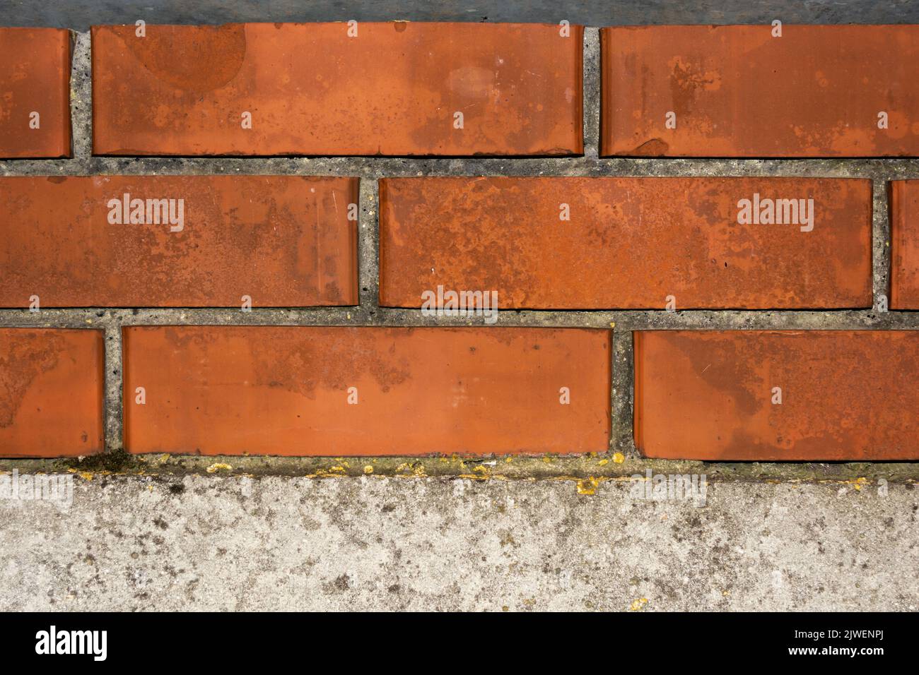 Brickwork of red brick for jointing on a concrete base Stock Photo - Alamy