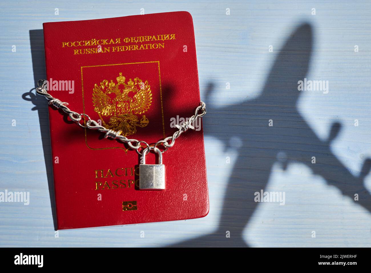Russian passport chained in a chain with a padlock is located ...