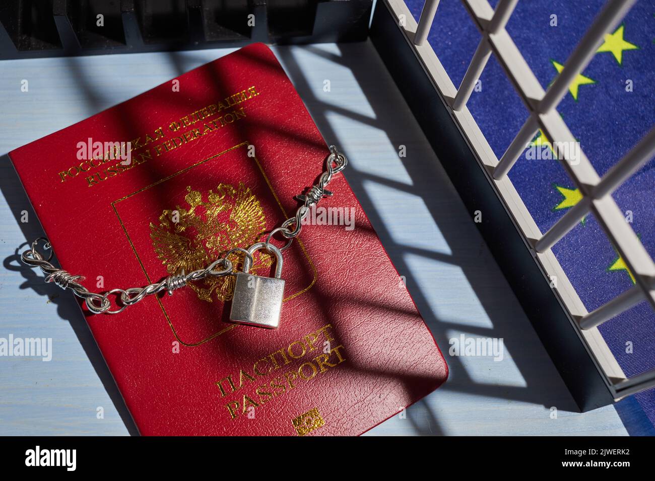 Russian passport chained in a chain with a padlock is located ...