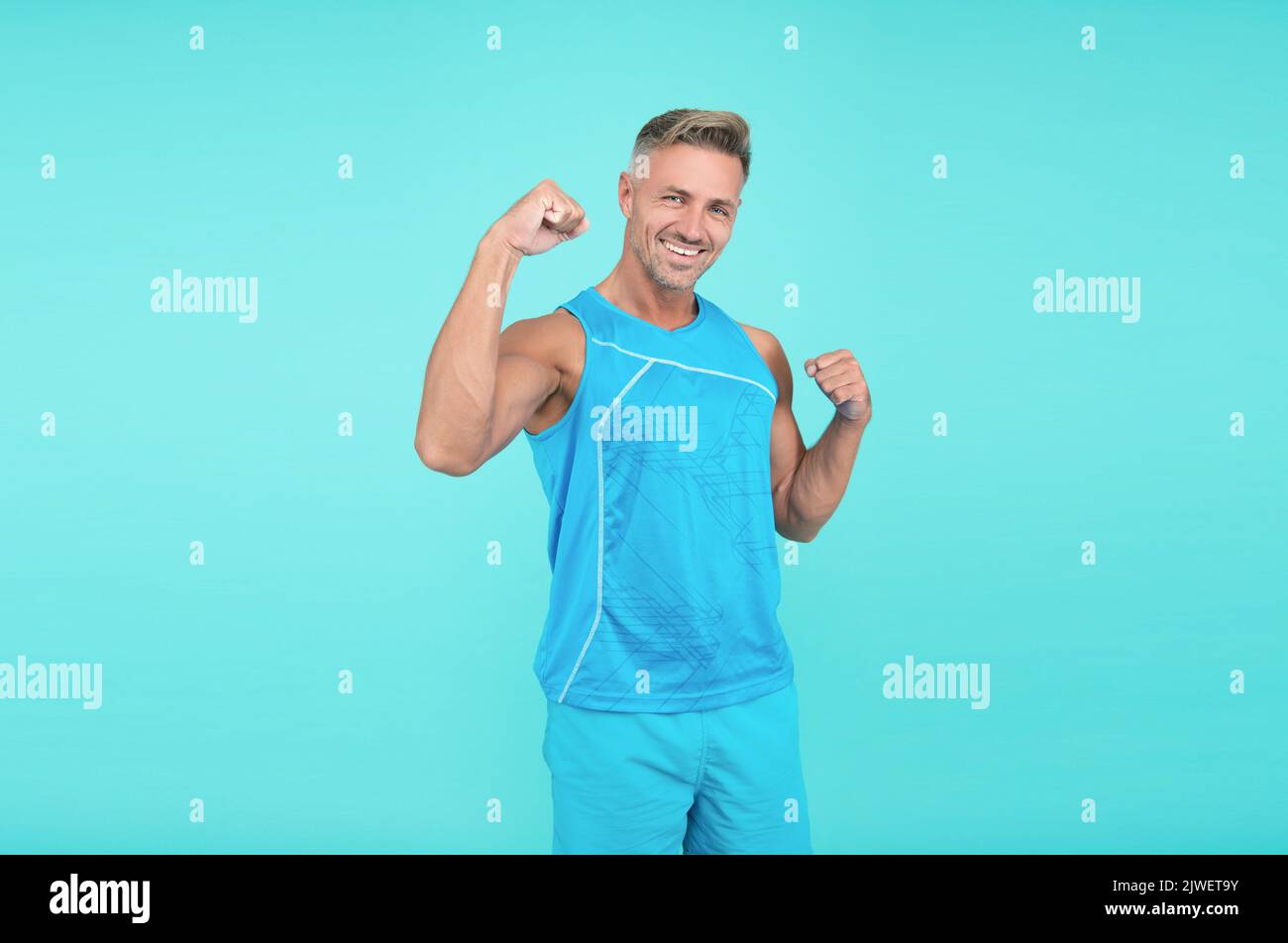 Happy sport athlete making winning gesture. athlete winner blue ...