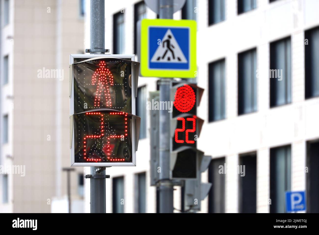 Red traffic lights on a city street. Countdown at the pedestrian ...