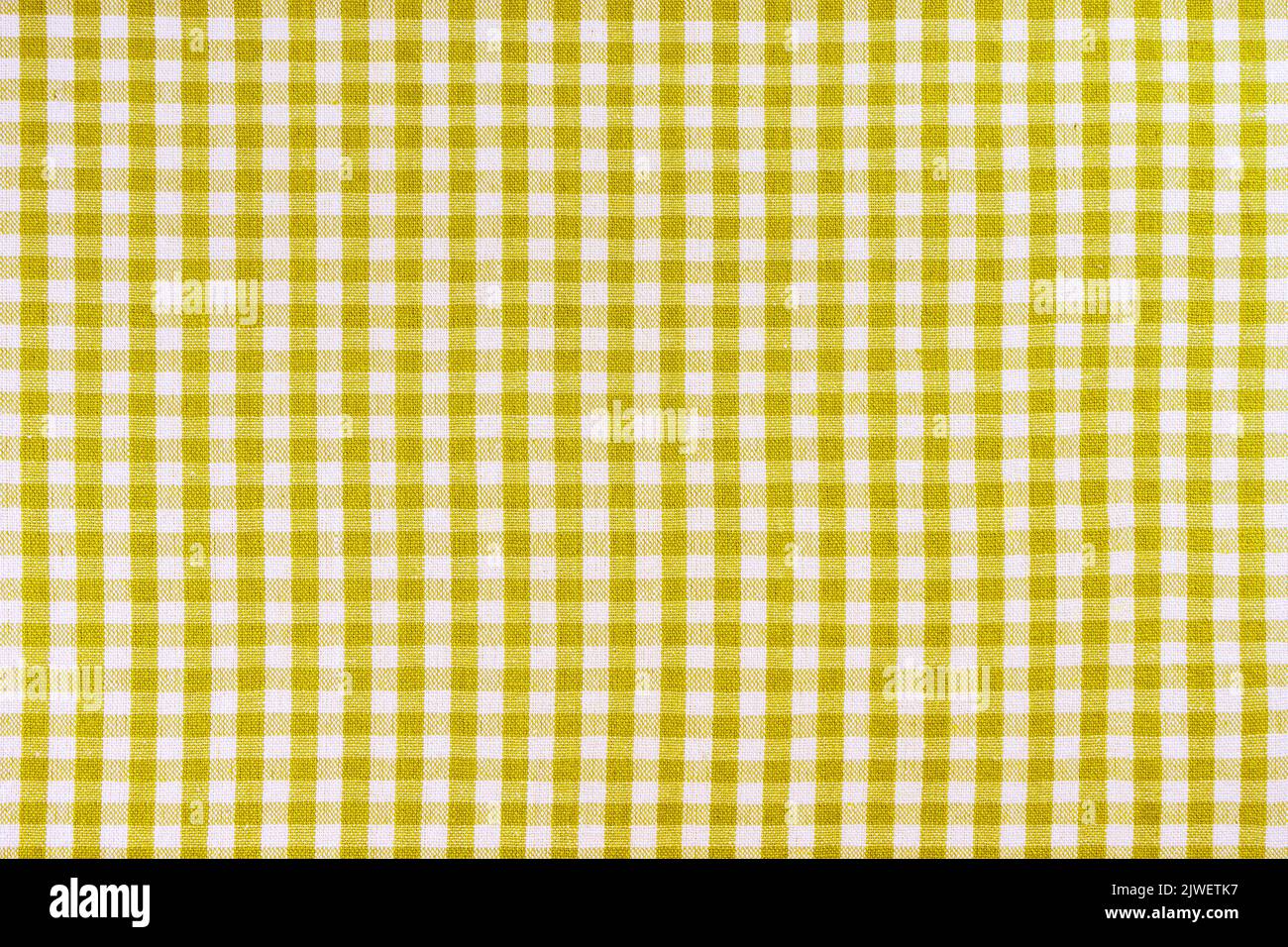 Yellow classic checkered tablecloth texture, background with copy space ...