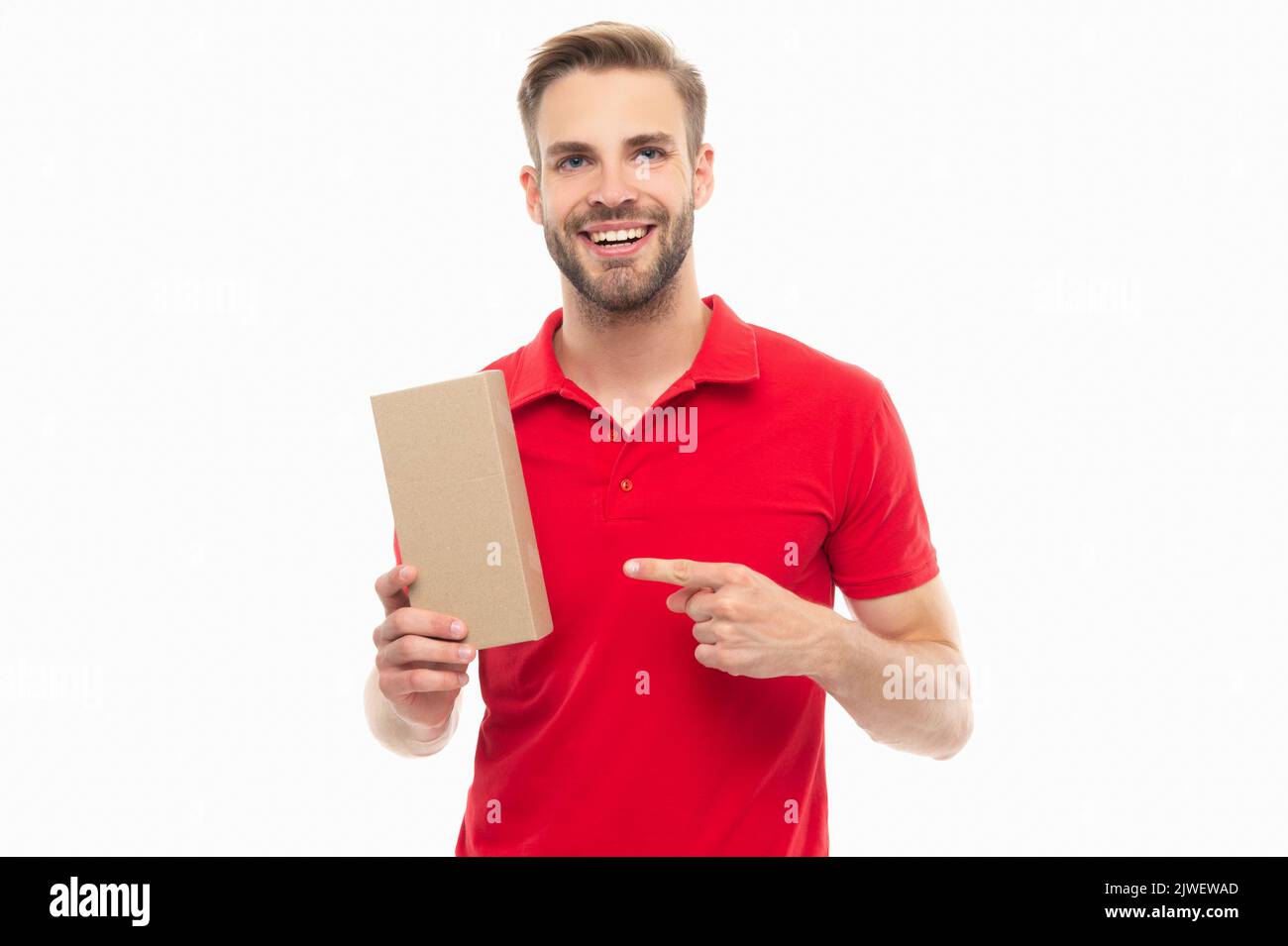 Happy man pointing finger at cardboard box. Delivery man isolated on ...