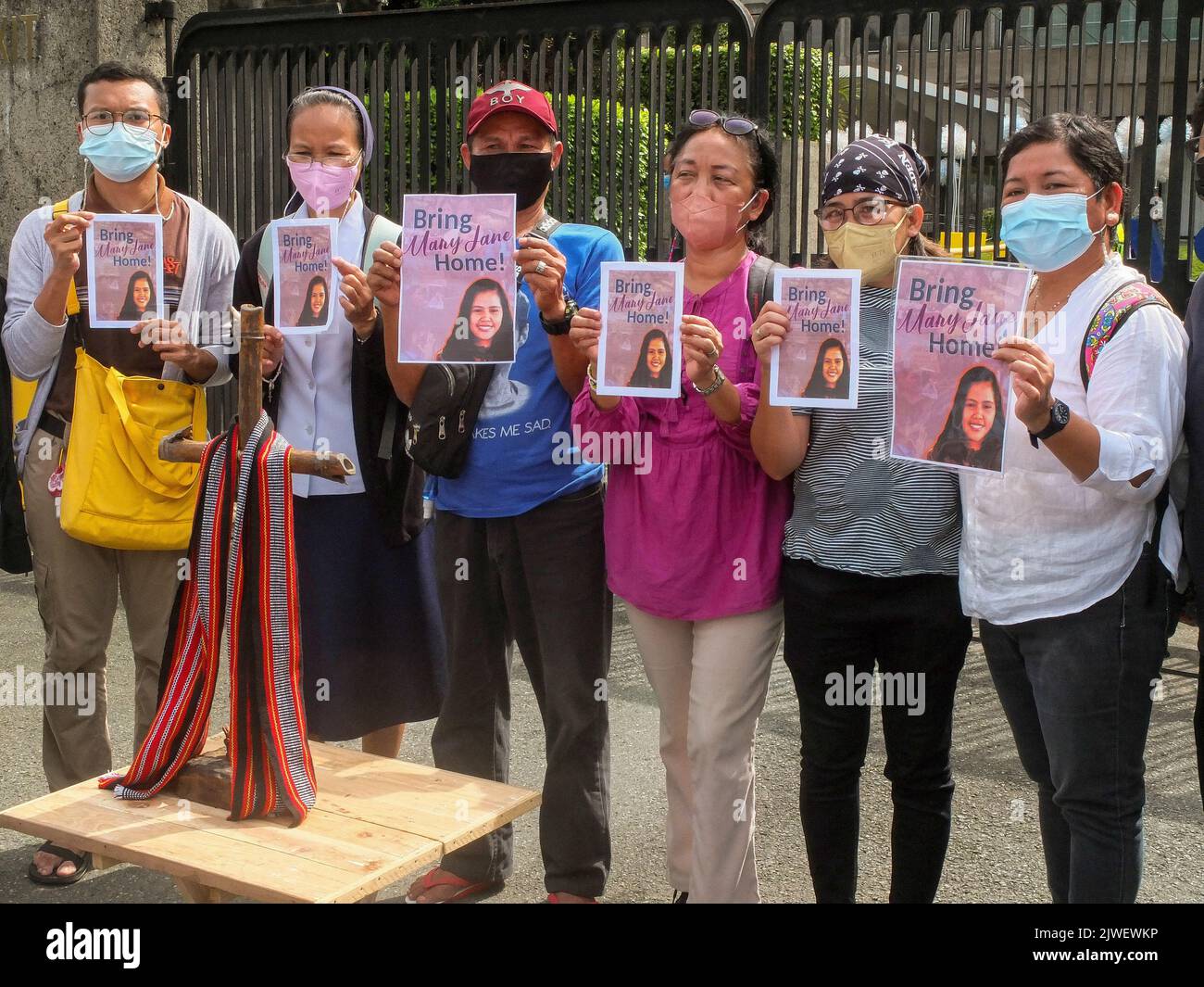 Protesters from different cause oriented groups hold posters with a ...