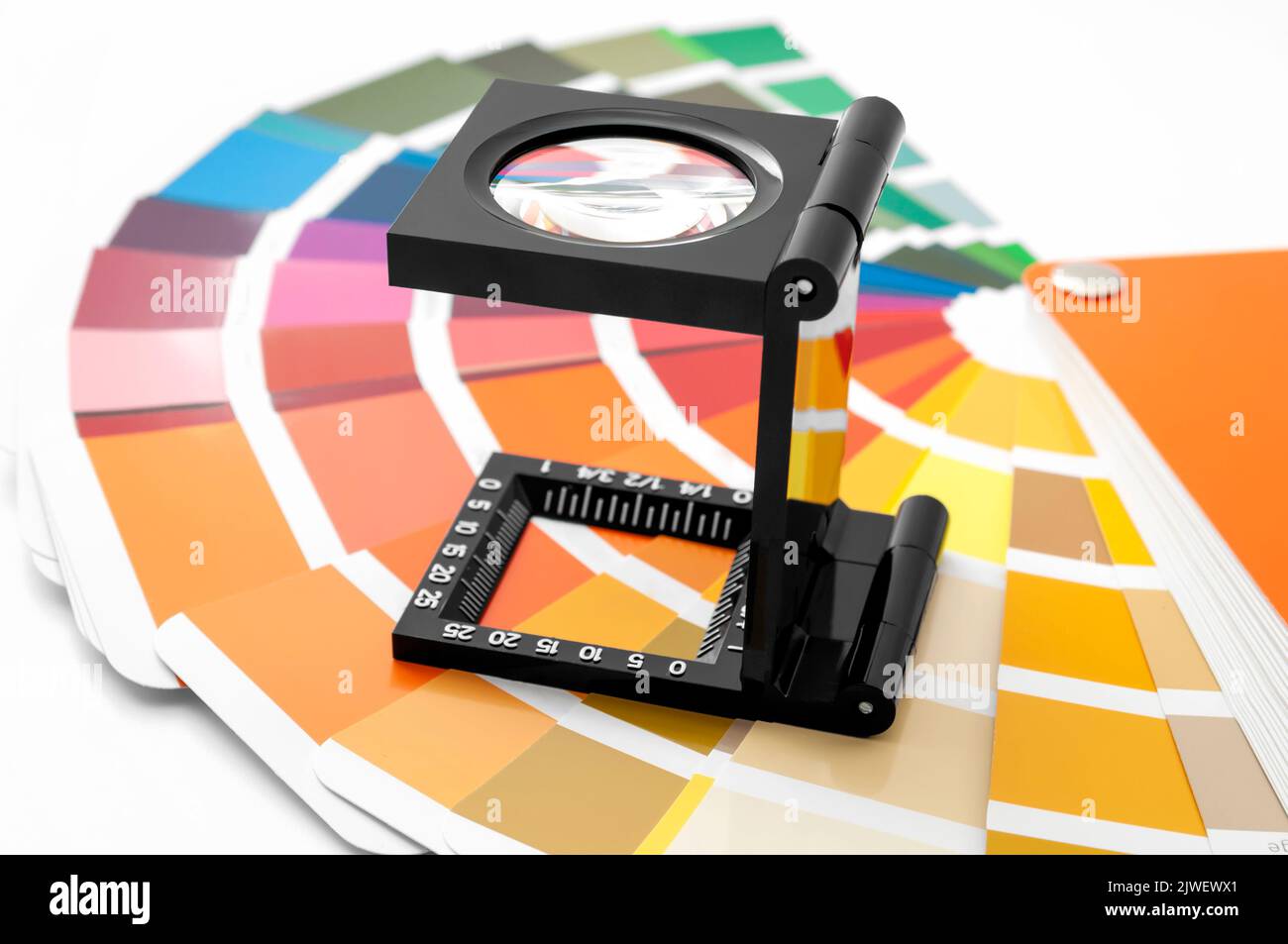 Printing loupe used to examine colour chart concept for color check ...