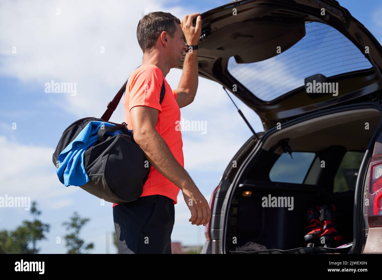 Athlete getting out of car hi-res stock photography and images - Alamy