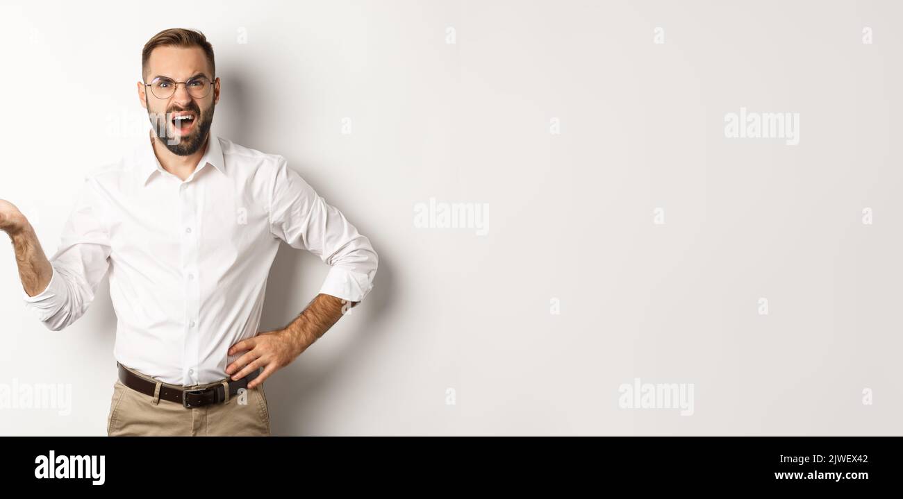 Frustrated office worker complaining, gesturing and looking ...