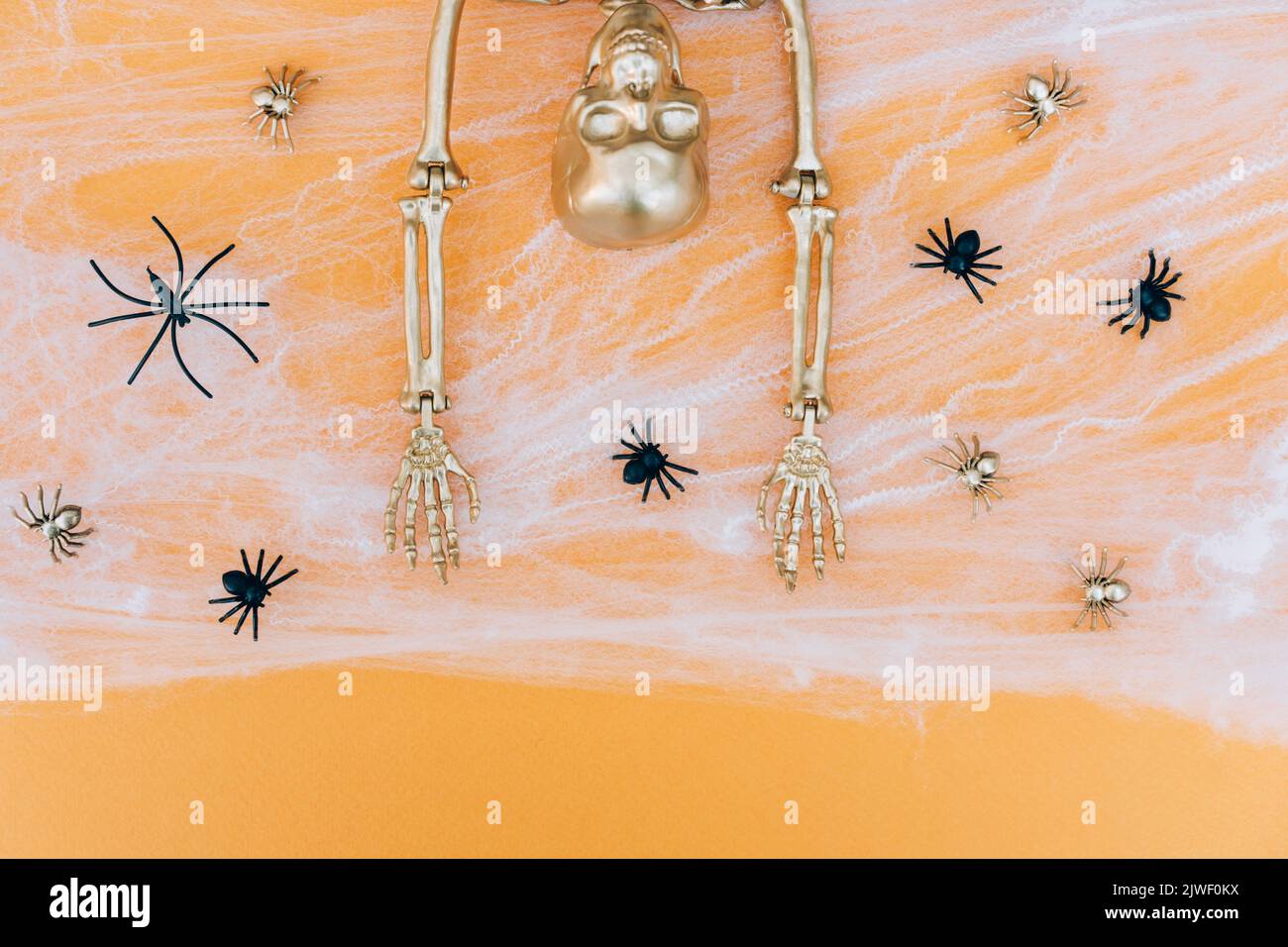 Funny halloween background with white cobweb, spiders and golden ...