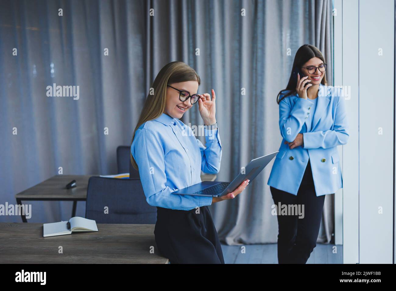 Manager woman in classic glasses smiling during working time in office ...