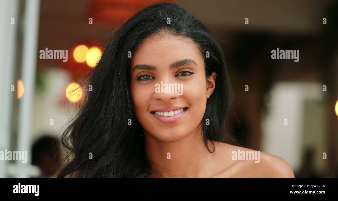 Beautiful young african mixed race woman smiling Stock Photo - Alamy