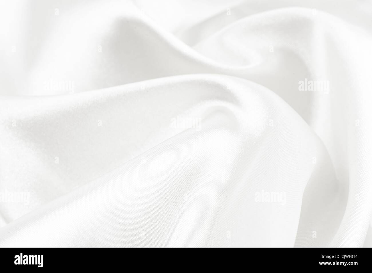 A twisted piece of white fabric. White material or texture with waves ...