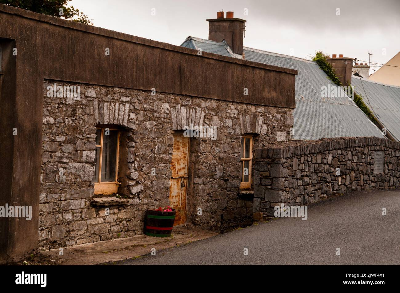 Stone facade and seamed metal roof in Ladysbridge, Ireland Stock Photo ...