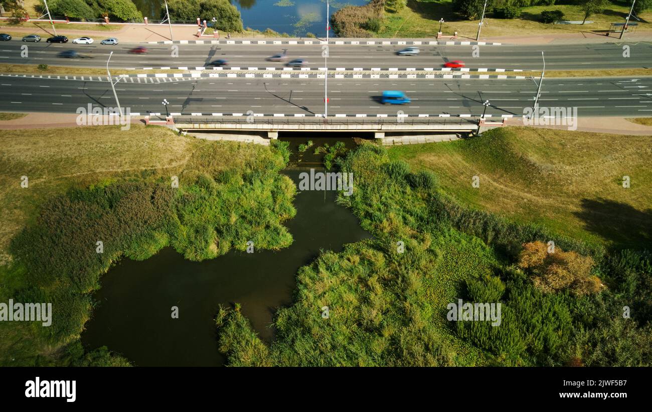 Multi-lane city highway. Overpass across the river. Aerial photography ...