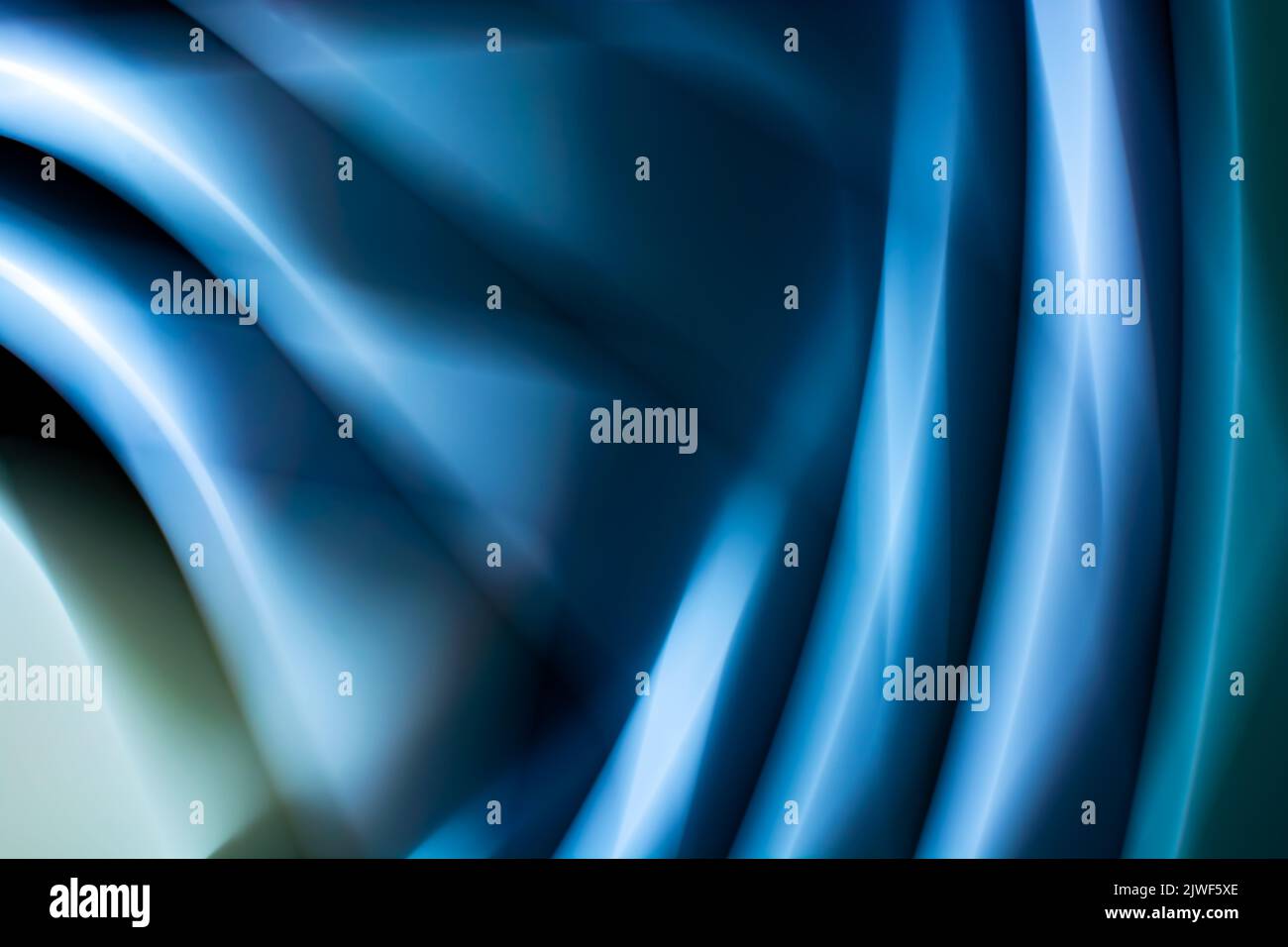 Glowing abstract background in cool blue tones on black from waves ...