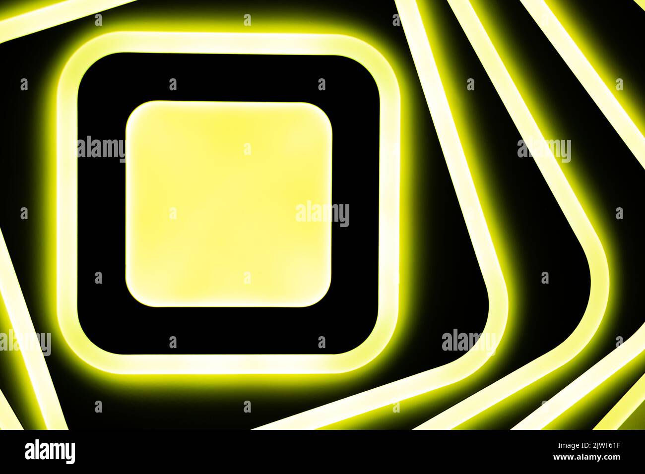 Abstract Yellow white LED lamp shining brightly on the ceiling ...
