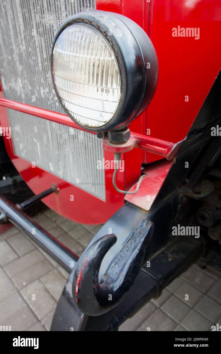 Elements of a vintage fire truck. The car is painted red. Close-up ...