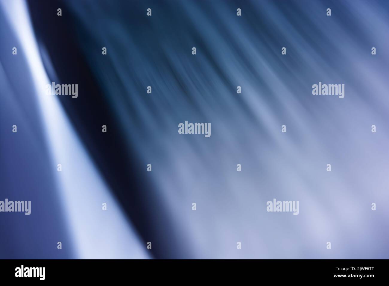 Abstraction. Blue softly blurred curtain. Waves, ripples and bright ...