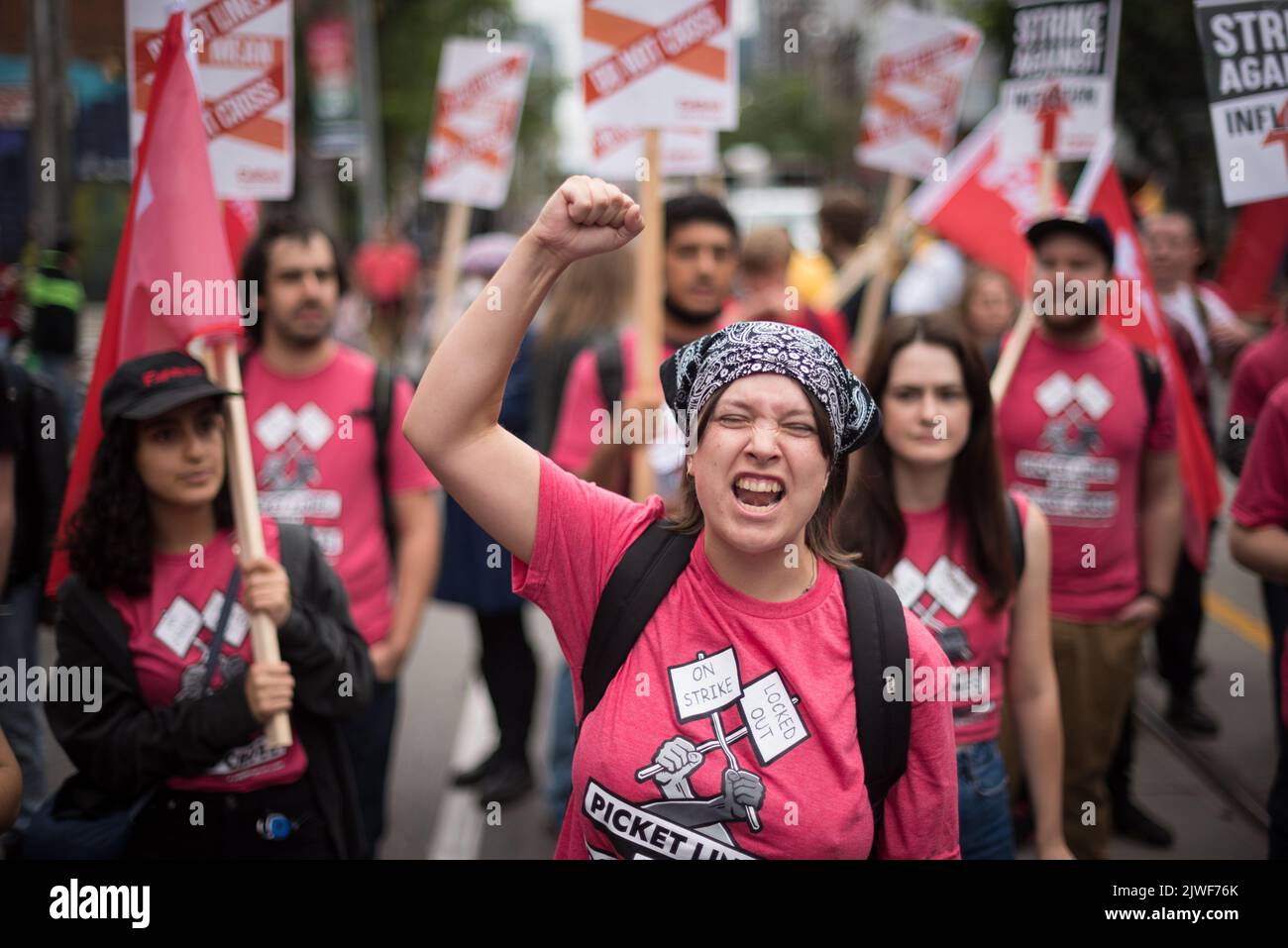 Participants chant as they march through Toronto during the Labour Day ...