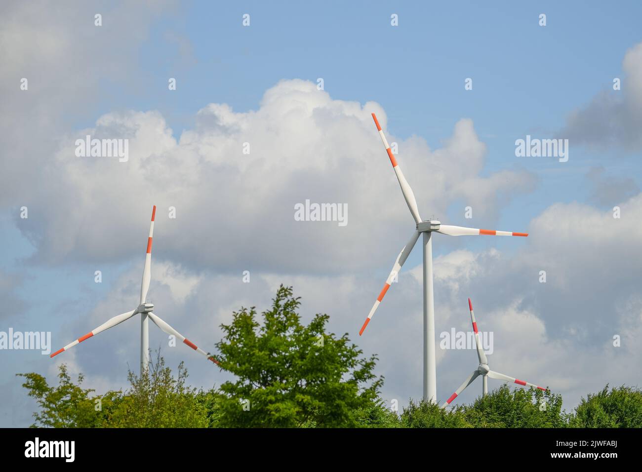 A countryside scene with wind turbines against the clouds Stock Photo ...