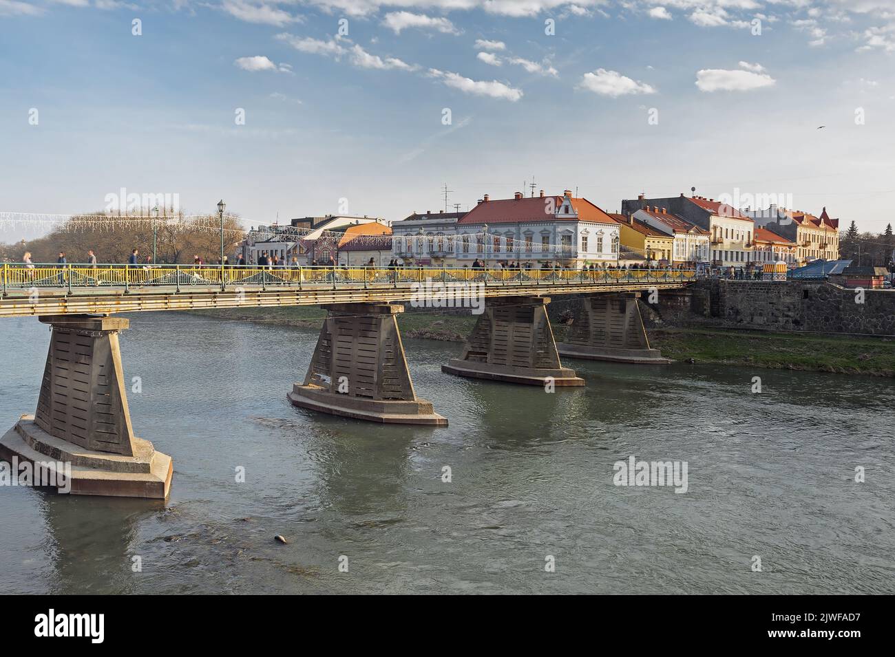 Old pedestrian bridge over Uzh river in Uzhhorod, Ukraine Stock Photo ...