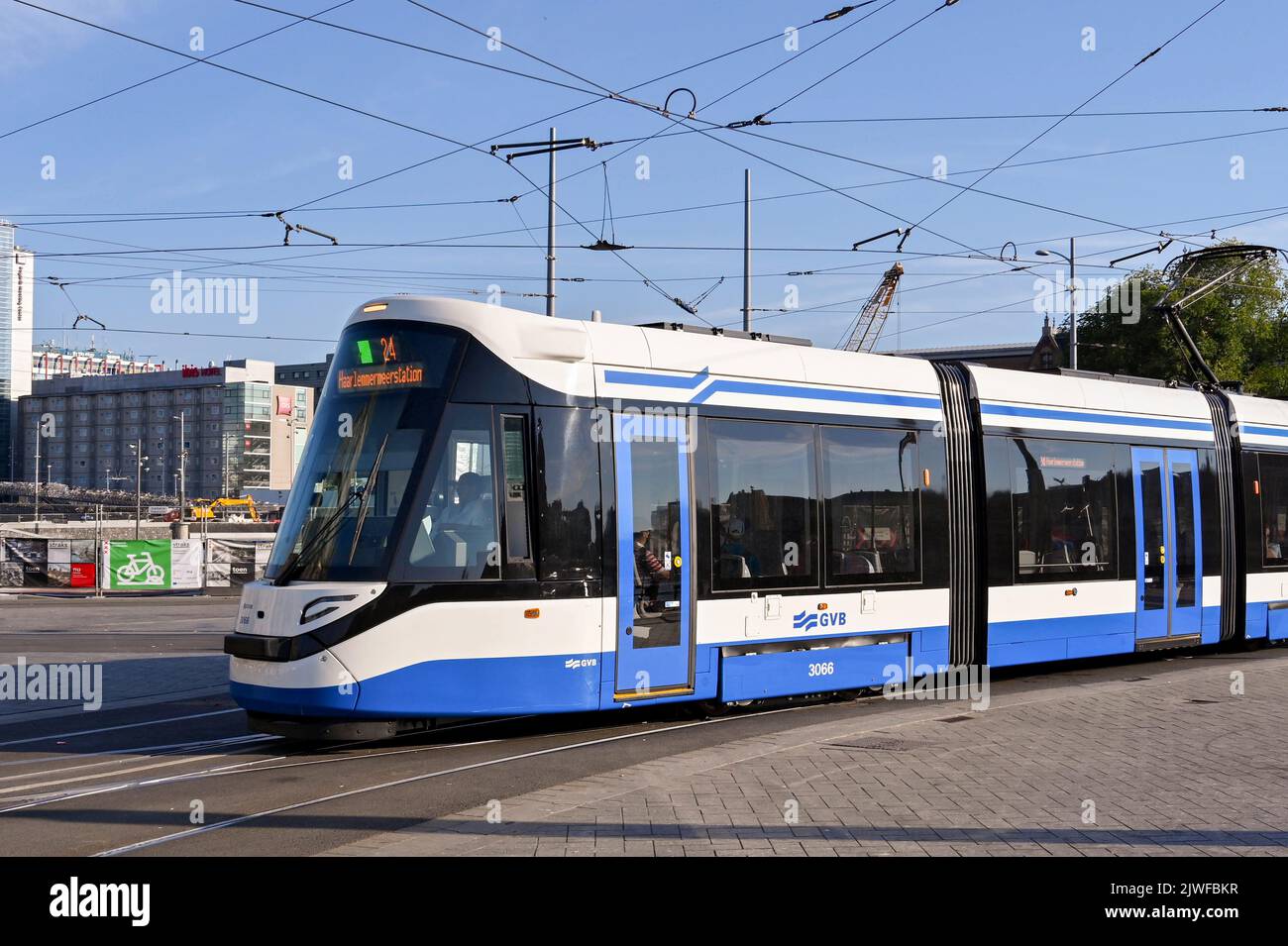 Amsterdam, Netherlands - August 2022: Electric tram passing through one of the streets in the ...