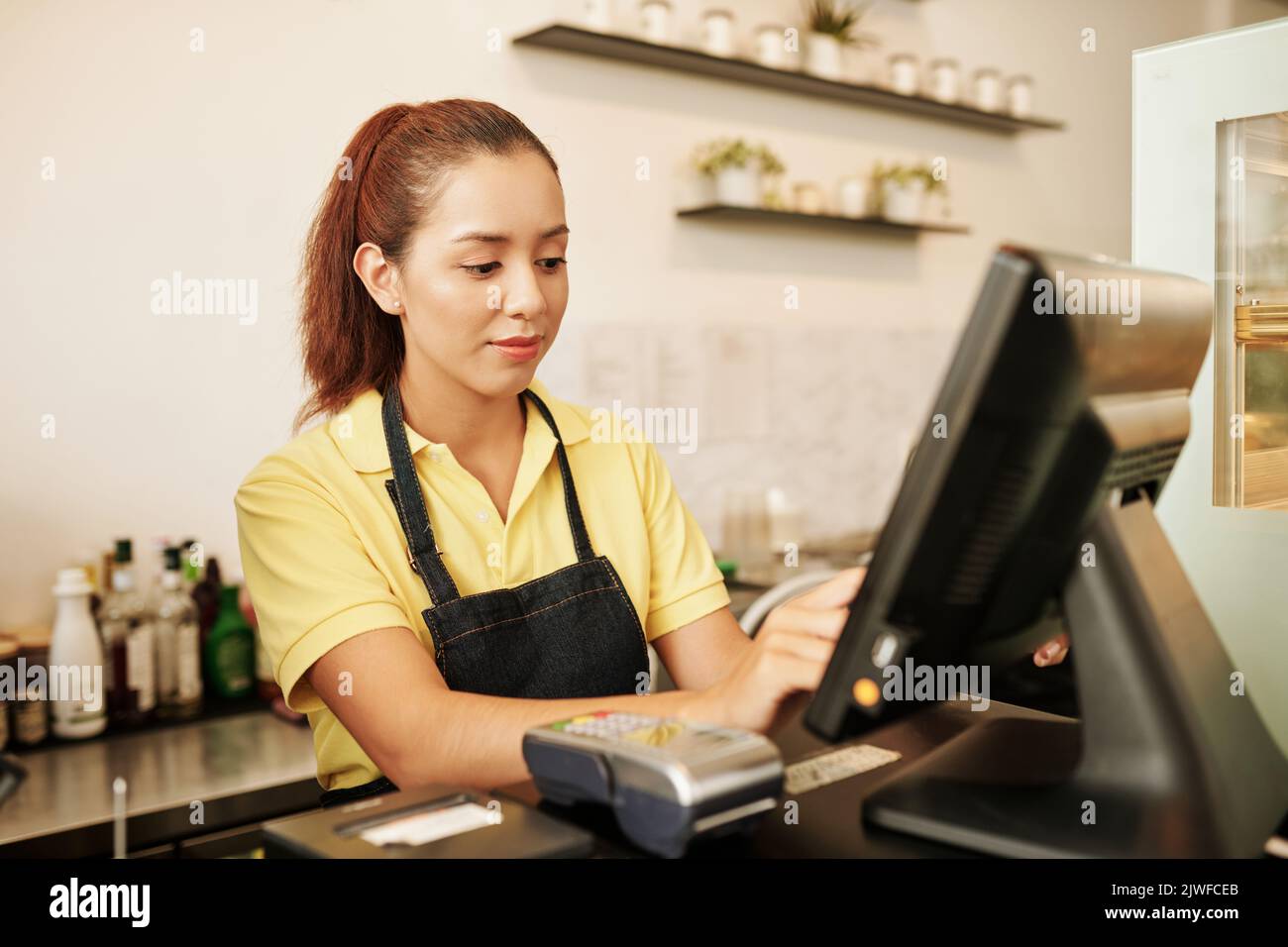 Working cashier in cafe hi-res stock photography and images - Alamy