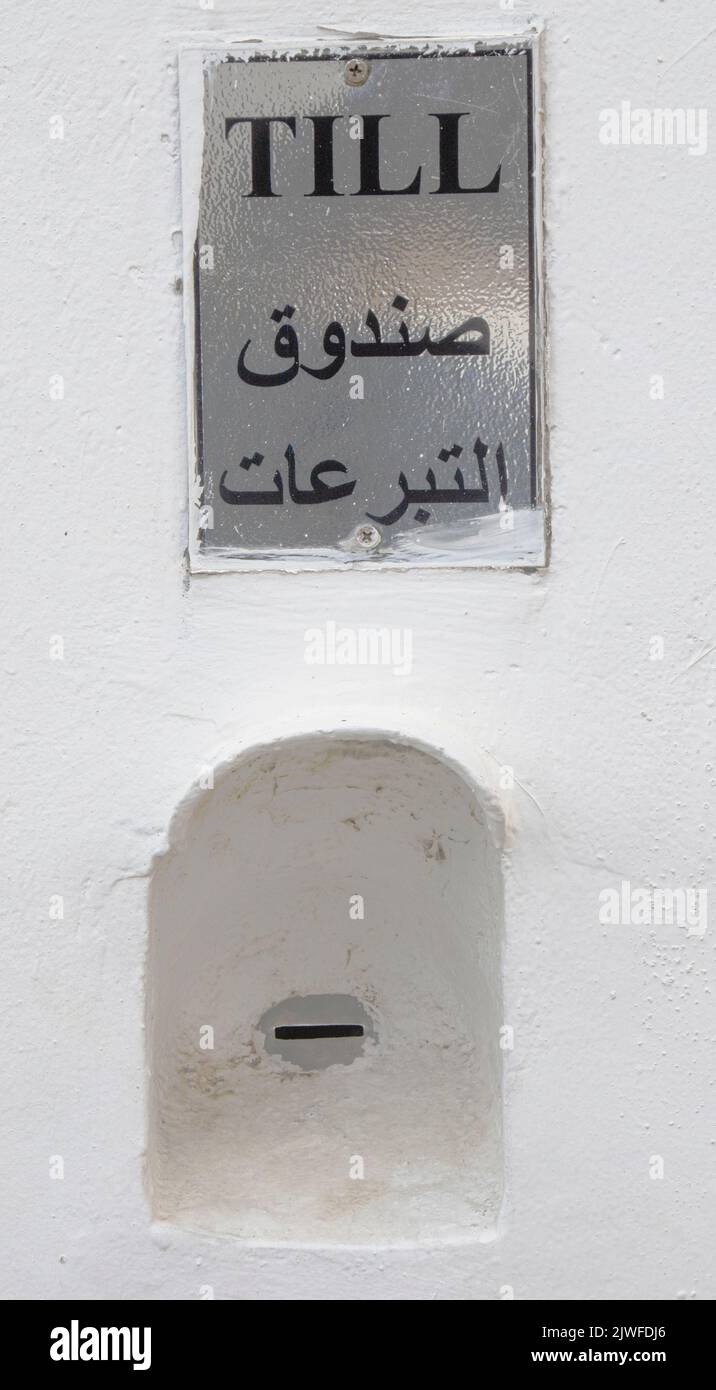 tithe; Sign with black letters; Collection of alms; church money box ...