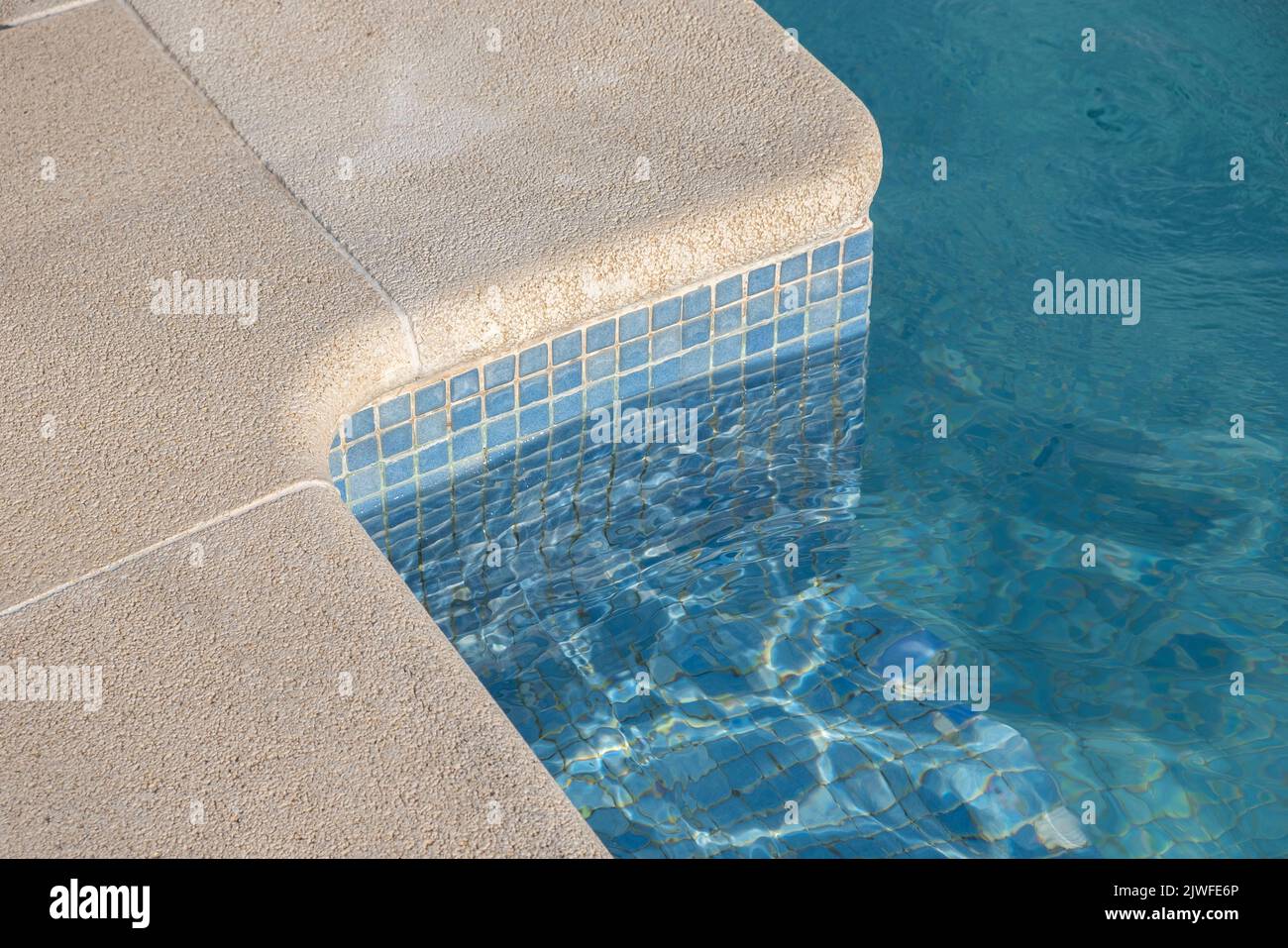 Edge of a clear water pool, summer time Stock Photo - Alamy