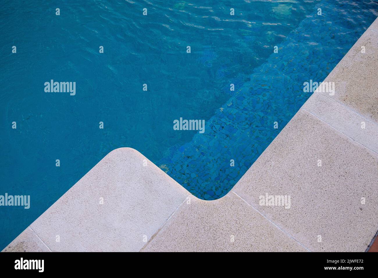 Edge of a clear water pool, summer time concept Stock Photo - Alamy