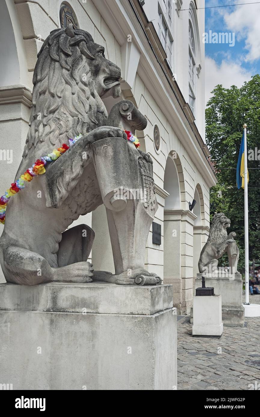 Sculptures of sitting lions with city of Lviv armorial bearing at the ...