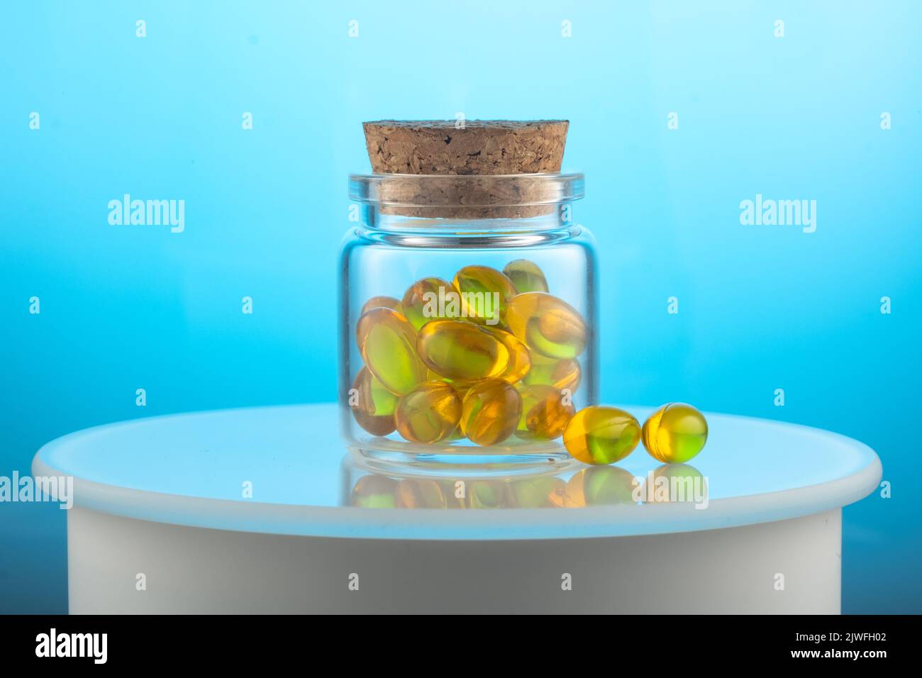 omega 3 vitamins on blue display display. shopping concept. champion of ...