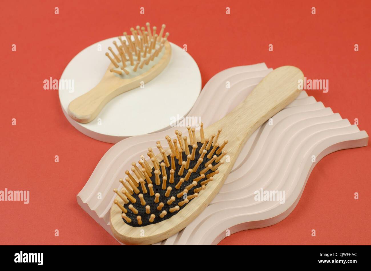 Hair brush made of natural material. Wooden hair combs on a beige ...