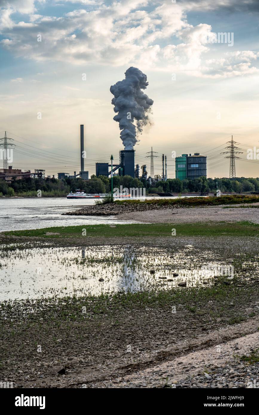 HKM Huckingen steelworks, coking plant, cargo ship on the Rhine, at ...