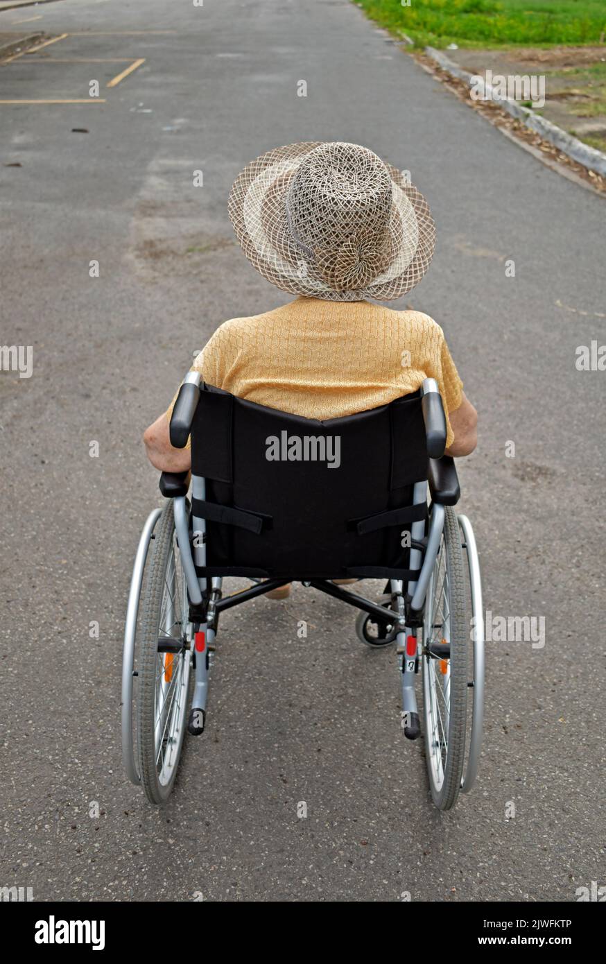 Old woman wheelchair user on the street Stock Photo - Alamy