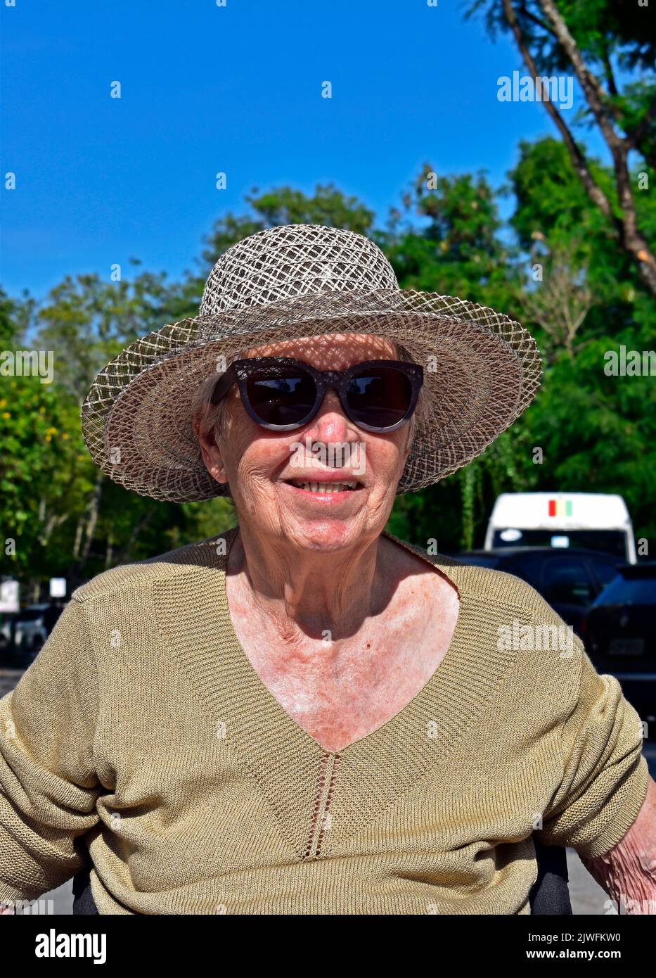 Senior elderly woman smiling on the sunbathing Stock Photo - Alamy