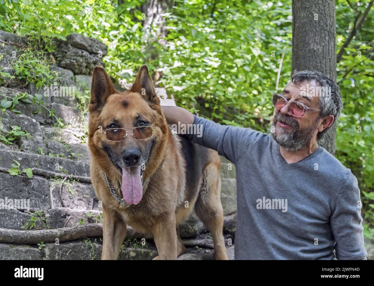 The Shepard dog and unidentified man both in glasses in Lviv, Ukraine ...