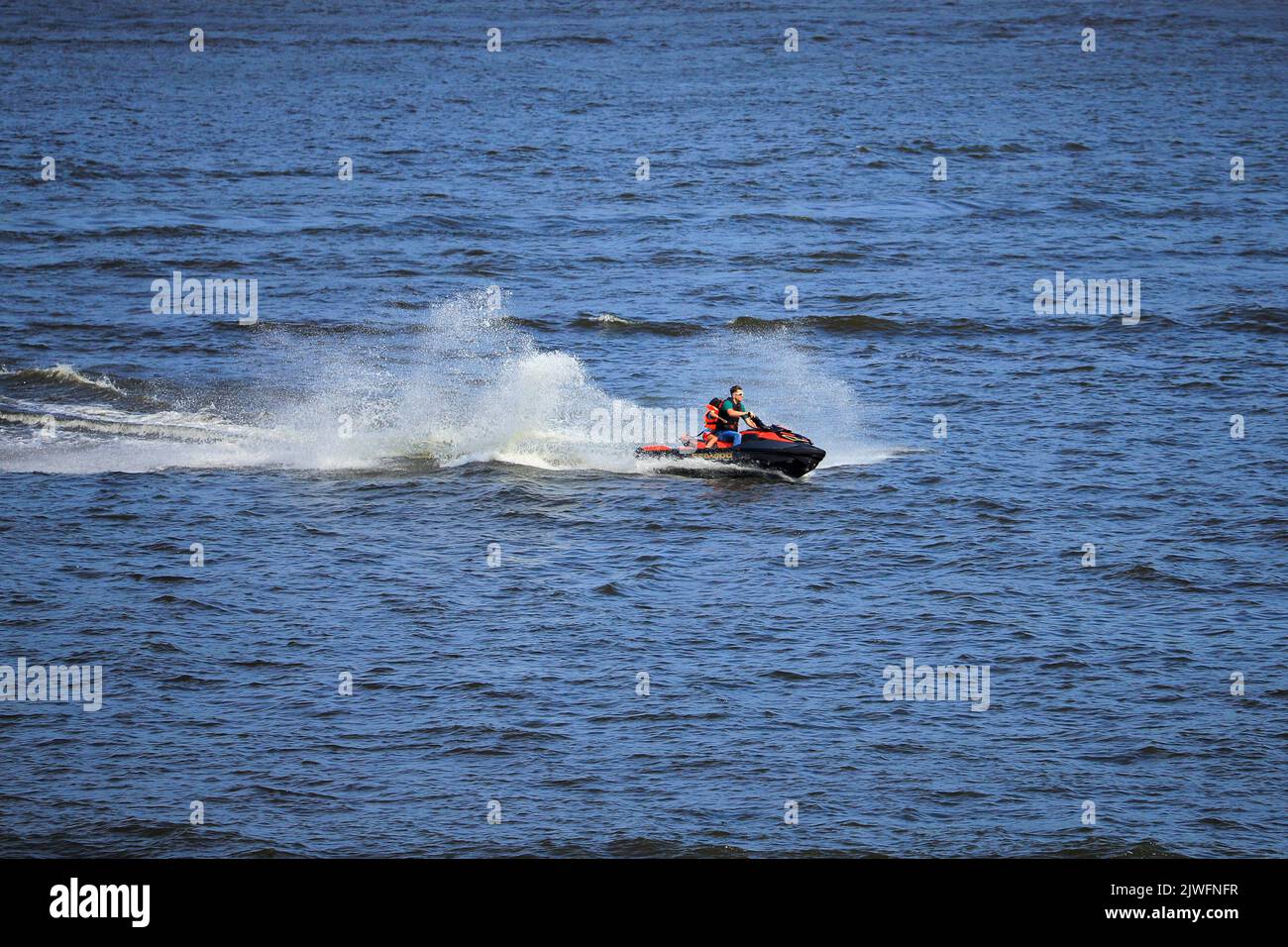 Man riding a jet ski on the river Stock Photo - Alamy