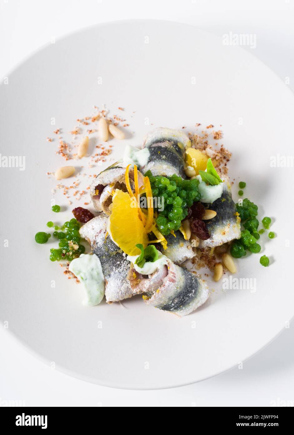 sardine rolls with parsley caviar. and citrus. high restaurant cuisine ...