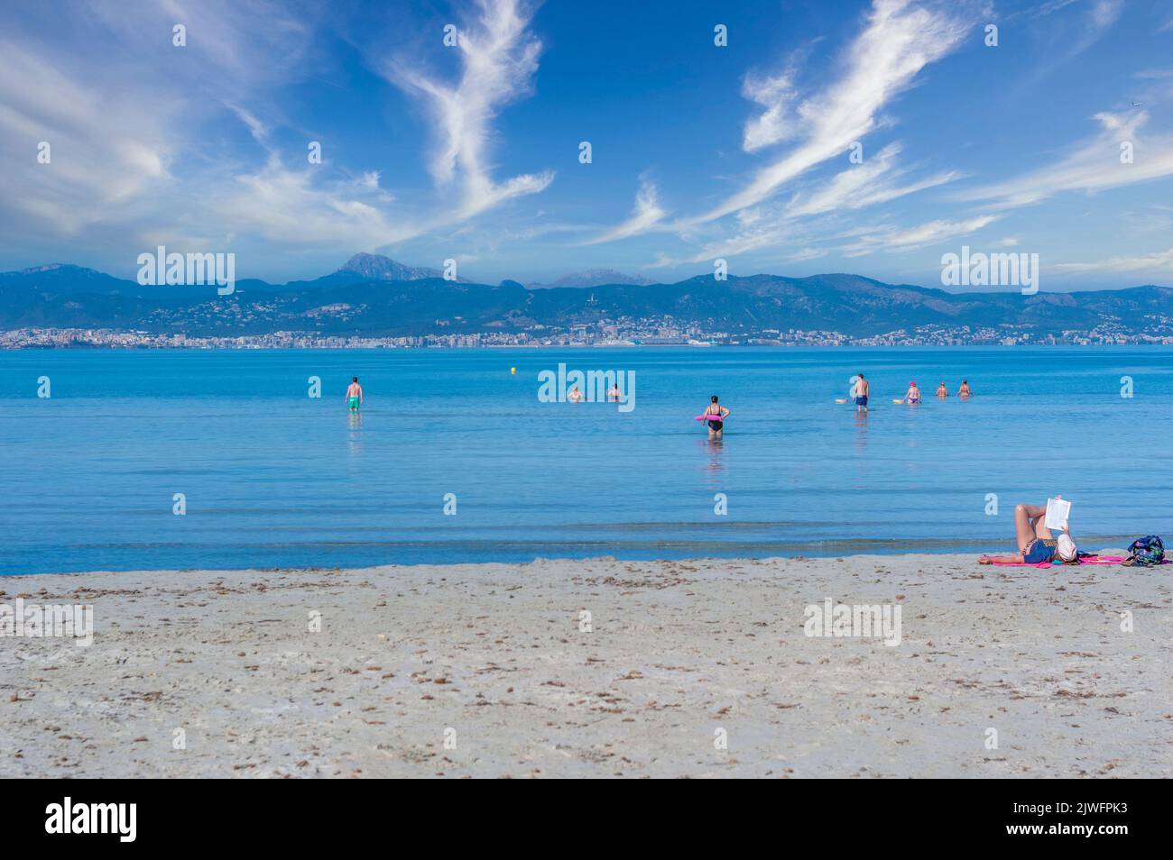 A view of people bathing in the crystalline and calm waters of beach ...