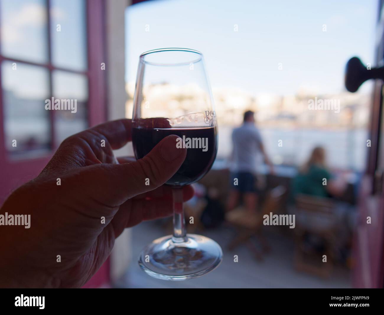Glass of Fine Ruby Port Wine in a traditional wine tasting restaurant ...