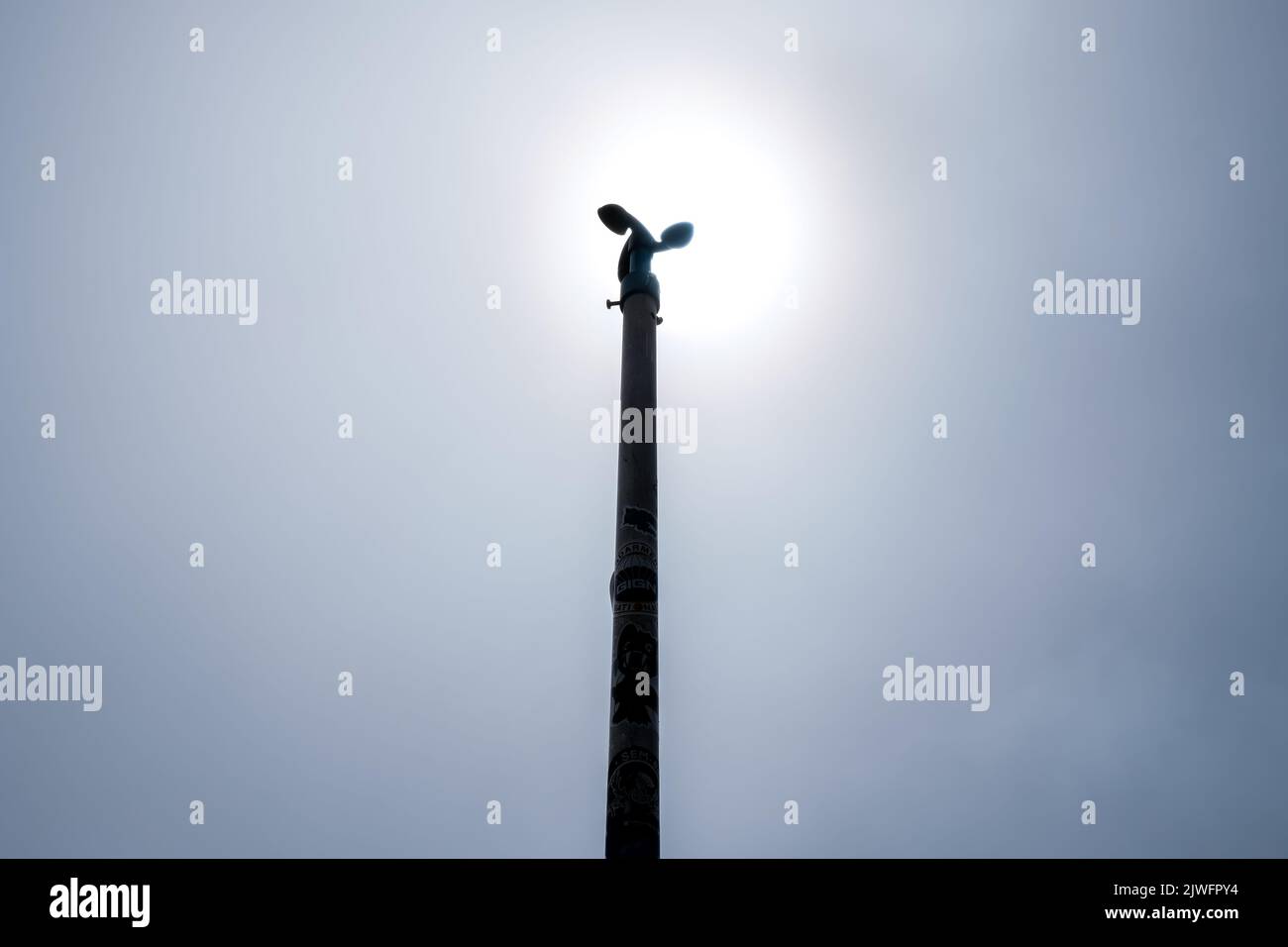 Backlit anemometer on a pole against the blue sky Stock Photo - Alamy